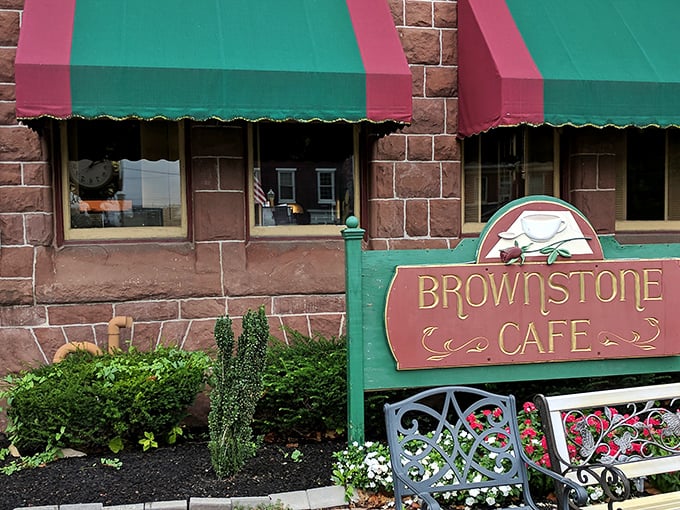The iconic brownstone exterior with its distinctive green and burgundy awnings invites you in like an old friend waiting with open arms.