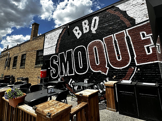 Smoque's iconic black and white exterior wall art isn't just signage—it's a beacon of hope for barbecue pilgrims seeking salvation through smoke.