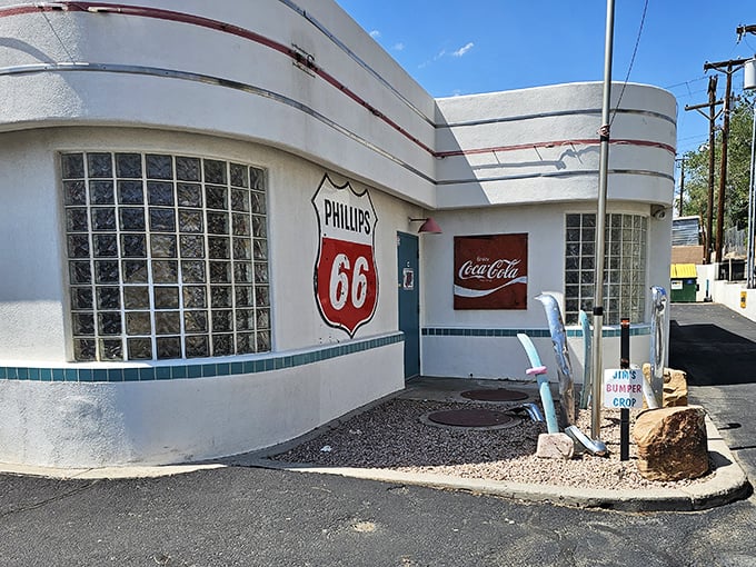 The gleaming white Art Deco curves of 66 Diner stand as a beacon of nostalgia on Central Avenue, promising comfort food and a trip back in time.
