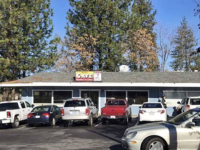 The unassuming blue exterior of Mandy's might not stop traffic, but the packed parking lot tells the real story—culinary treasures await inside.