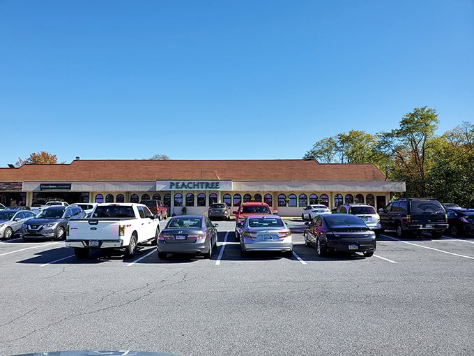 A full parking lot never lies! Peachtree's unassuming strip mall exterior hides culinary treasures that keep locals coming back day after day.