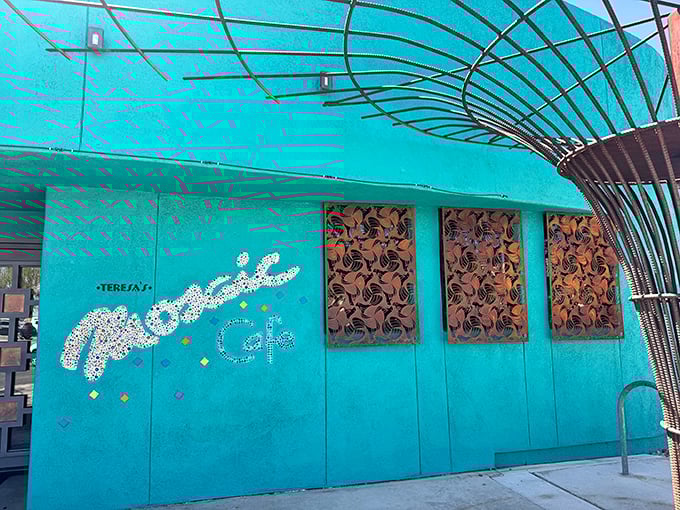 That turquoise exterior isn't just a building—it's a promise of the vibrant flavors waiting inside Teresa's Mosaic Cafe. The architectural equivalent of a dinner bell.