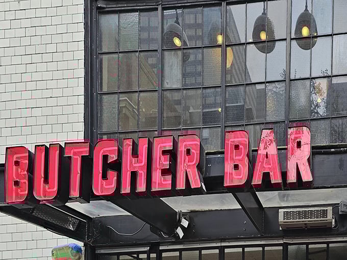 That glowing red sign isn't just a logo—it's a beacon for meat lovers, promising carnivorous delights within those white-tiled walls.
