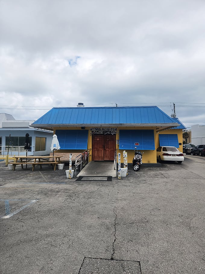 Blue roof, yellow walls, wooden door - this humble building houses burger perfection that locals have treasured for decades.