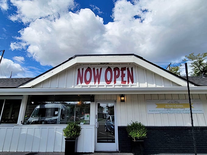 The "NOW OPEN" sign feels like a permanent welcome, promising that whatever culinary troubles you have, they'll be solved inside.