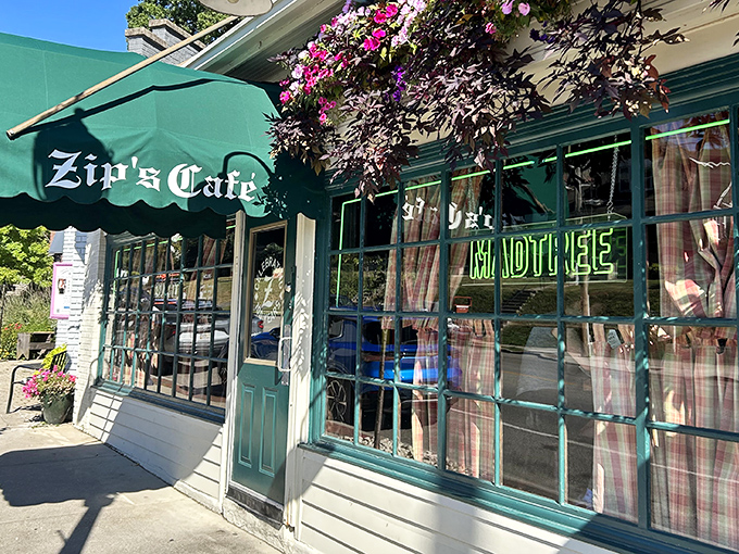 The iconic green awning of Zip's Cafe welcomes hungry visitors like an old friend who happens to make incredible burgers.