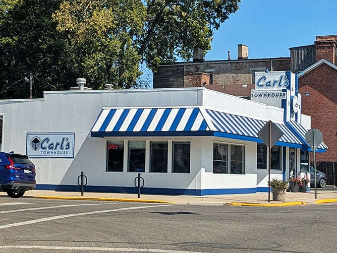 The blue and white striped awning of Carl's Townhouse isn't just eye-catching—it's a beacon of breakfast hope on Chillicothe's streets. Classic Americana at its finest.