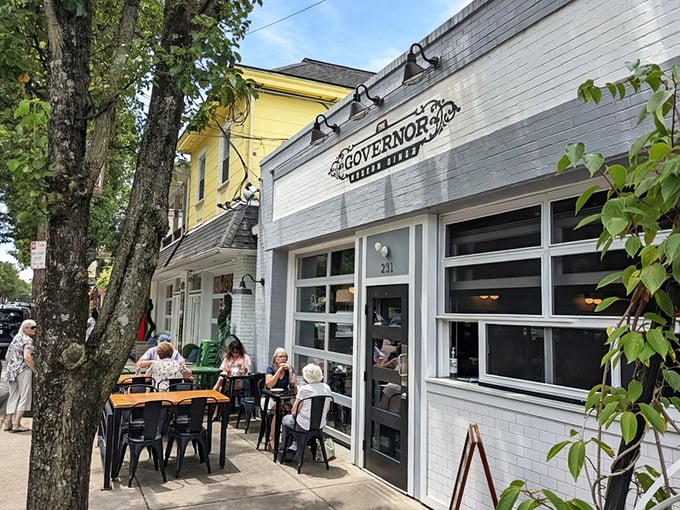 The Governor's crisp white exterior and inviting patio seating create the perfect small-town backdrop for culinary magic in historic Milford.