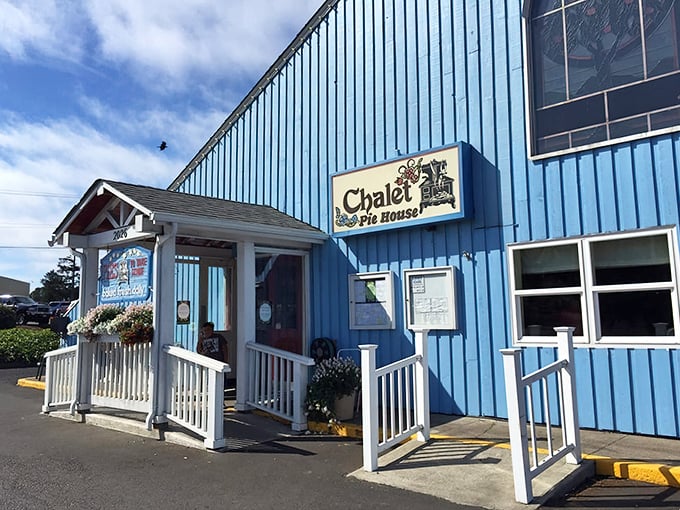 Bathed in Oregon sunshine, the Chalet's distinctive blue siding and welcoming entrance create the perfect first impression – like finding the Swiss Alps' coziest bakery mysteriously transported to Newport's coastline.