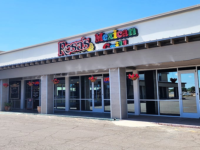 The rainbow-colored sign beckons like a fiesta invitation. Rosa's Mexican Grill might sit in a modest strip mall, but those vibrant letters promise culinary adventures await inside.