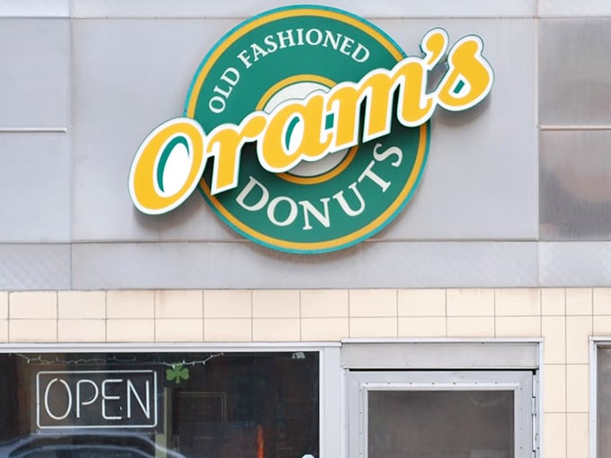 The sign says "Old Fashioned" but those donuts inside are pure modern-day happiness waiting to happen.