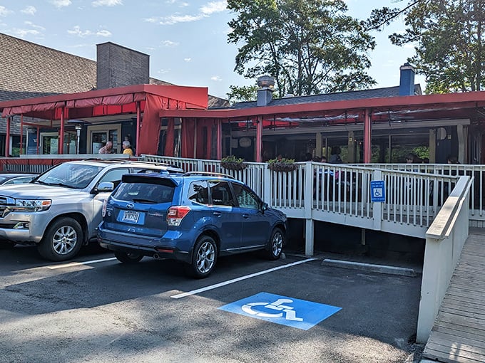 Southern comfort waits inside—just look for the little blue house with a cars out front.