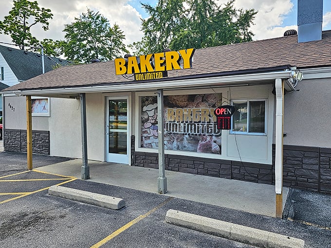 That bright yellow "BAKERY UNLIMITED" sign isn't just advertising – it's practically a beacon of hope for donut lovers everywhere.