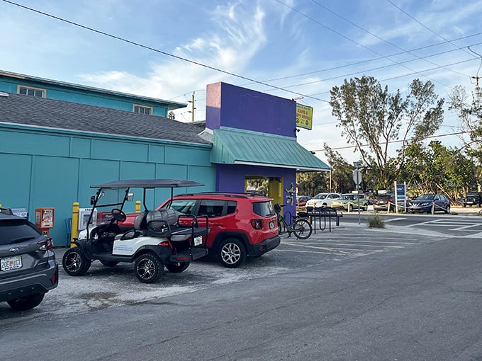 The turquoise and purple exterior stands out like a tropical bird among palm trees, announcing "vacation mode activated" to all who pass by.