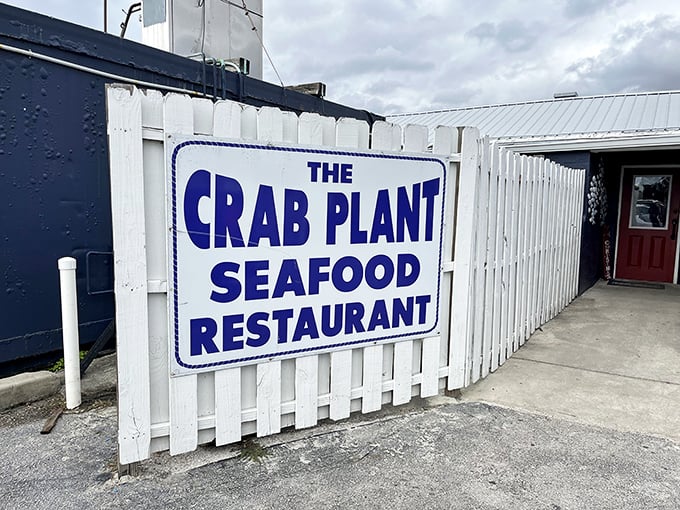 The white picket fence and bold blue lettering say it all – no pretense, just the promise of seafood that'll make you forget your table manners.