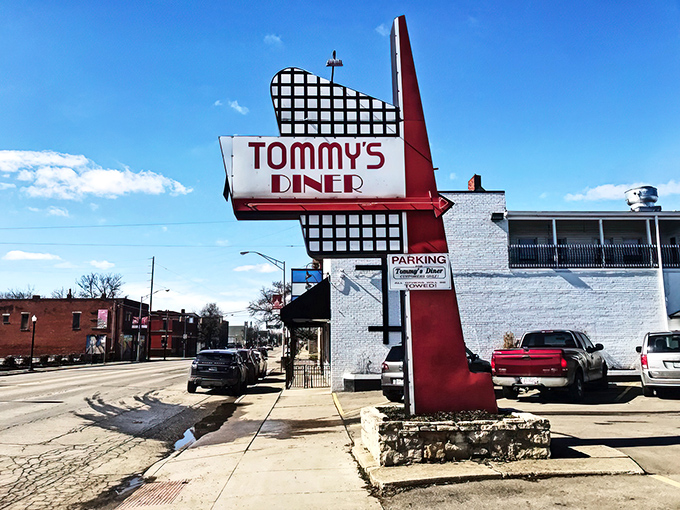 That iconic red and white sign isn't just announcing a diner—it's promising a time machine to when breakfast was an art form and calories didn't count.