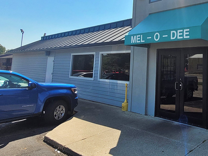 The unassuming blue exterior of Mel-O-Dee belies the culinary treasures within—like finding a Michelin-worthy meal in your favorite aunt's living room.