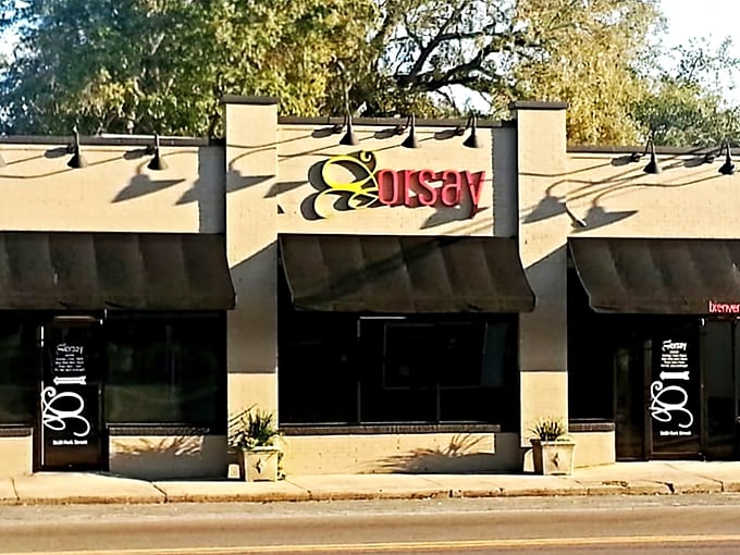 The elegant façade of Orsay welcomes you with its distinctive signage, promising a French culinary adventure in Jacksonville's historic Avondale neighborhood.