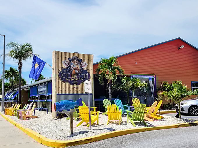 Those colorful Adirondack chairs aren't just seating—they're an invitation to slow down and embrace Florida's coastal vibe at The Conch Republic Grill.