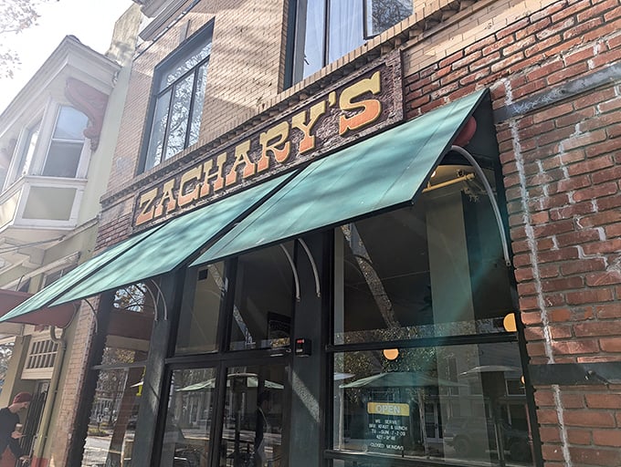 The iconic brick facade of Zachary's with its forest green awnings stands as a beacon for breakfast lovers in downtown Santa Cruz.