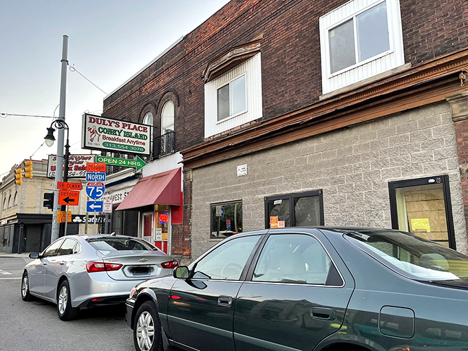 The corner brick building stands like a sentinel of sustenance, its vintage sign promising Detroit comfort food that transcends time. A culinary landmark that's seen it all.