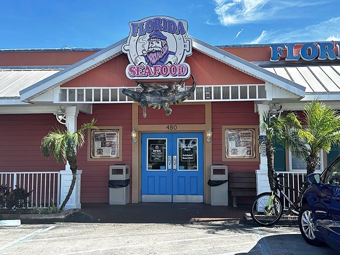 The coral-colored exterior with its bright blue doors screams "Old Florida charm" – before you even step inside for those legendary gator bites.