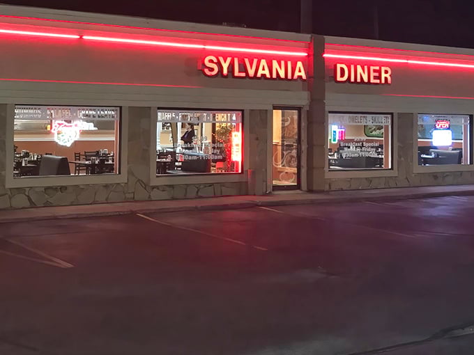 The neon glow of Sylvania Diner at dusk isn't just a sign—it's a beacon for breakfast lovers seeking refuge from chain restaurant mediocrity.
