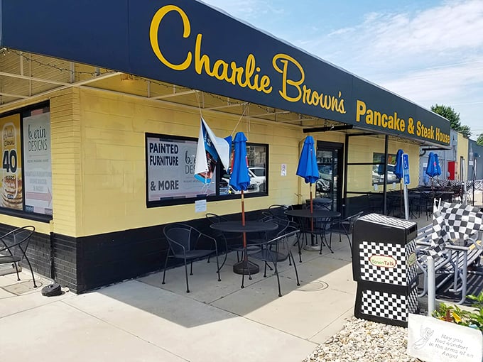 The cheerful yellow exterior with bold blue signage isn't trying to win architectural awards—it's too busy perfecting breakfast classics that keep locals coming back.