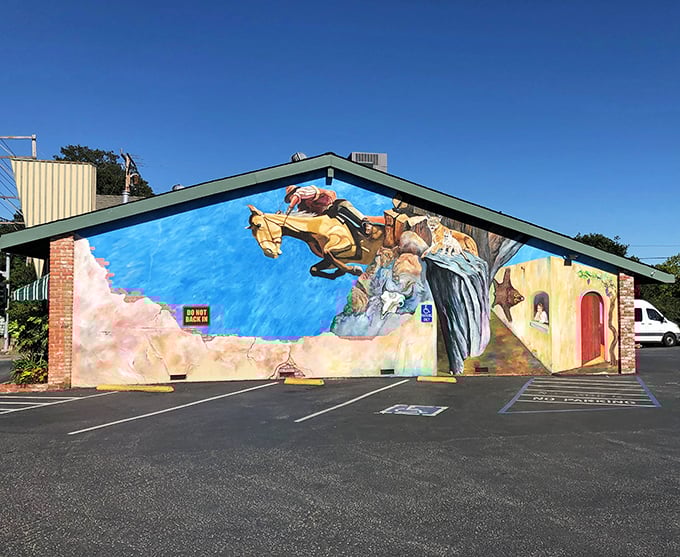 The cowboy mural leaping across this Santa Cruz diner's exterior isn't just decoration—it's a promise of the wild west of flavor waiting inside.