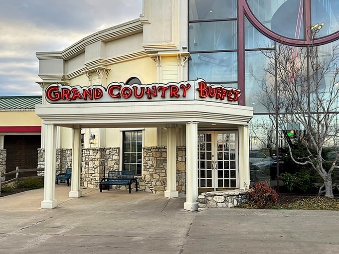 The welcoming facade of Grand Country Buffet beckons hungry travelers with its stone columns and bold signage—like a beacon of comfort food in Branson's entertainment landscape.