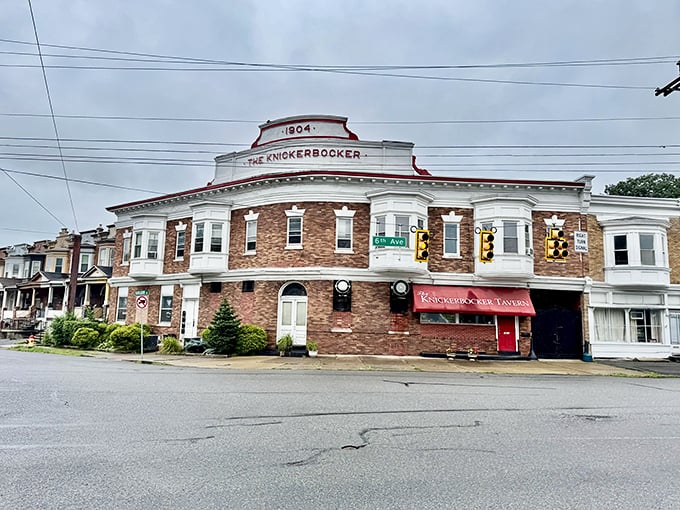 The historic 1904 building stands like a sentinel of good taste at the corner, its red awning beckoning hungry travelers with promises of comfort food glory.