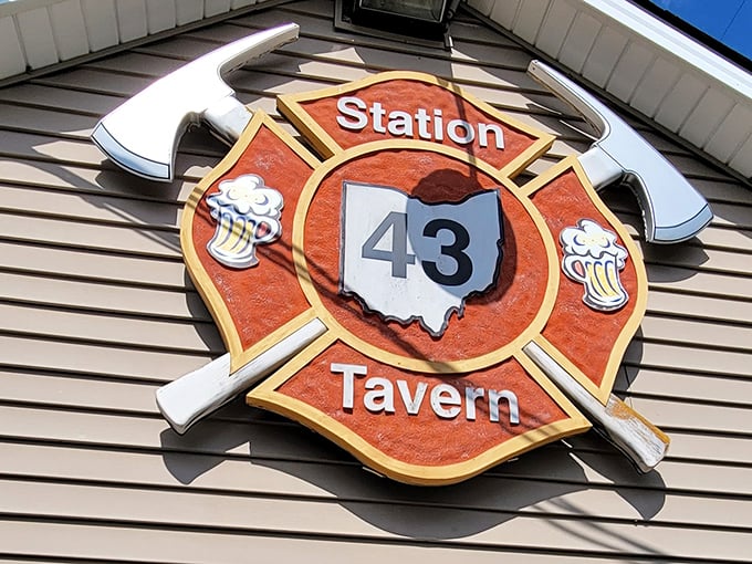 The iconic Station 43 Tavern sign says it all – Ohio-shaped logo, crossed fire axes, and beer mugs. This isn't just branding; it's a promise of what awaits inside.