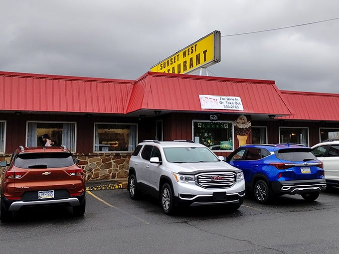 The bright yellow sign against the red roof is like a beacon for hungry travelers – Pennsylvania's version of a culinary lighthouse.