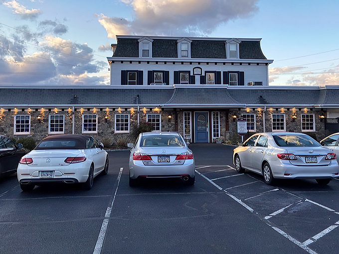 The historic stone facade of Spring House Tavern stands proudly against the Pennsylvania sky, promising culinary treasures within its centuries-old walls.