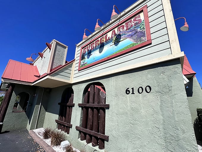 The turquoise blue exterior with coral roof isn't just Florida architecture—it's a promise of the coastal flavor fiesta waiting inside.