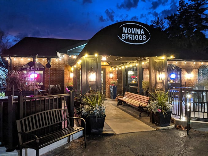 Twilight transforms Momma Spriggs into a beacon of culinary promise, with string lights twinkling like stars guiding hungry travelers to this brick-faced sanctuary of comfort food.
