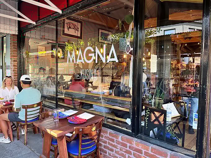 Like a warm invitation written in glass and wood, this storefront whispers promises of Filipino culinary adventures.