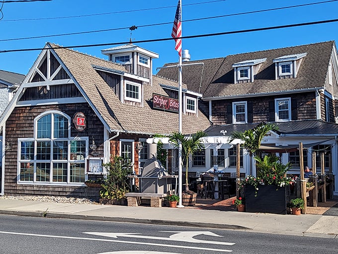 The coastal charm of Striper Bites welcomes you with weathered cedar shingles and a cozy porch—like a postcard from seafood heaven come to life.
