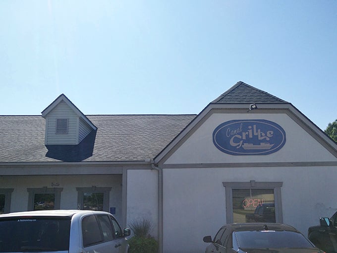 The welcoming facade of Canal Grille stands ready to rescue hungry travelers with its homestyle charm and corrugated metal porch railings.