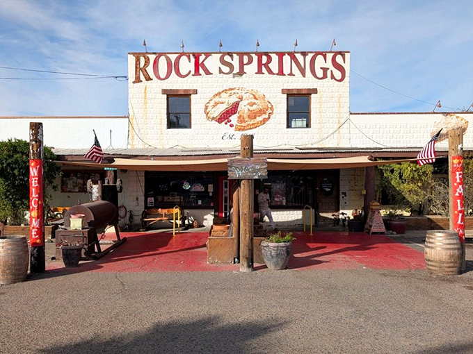 The iconic whitewashed facade of Rock Springs Café stands like a desert mirage, promising sweet salvation to highway travelers since long before Instagram made food photos a thing.