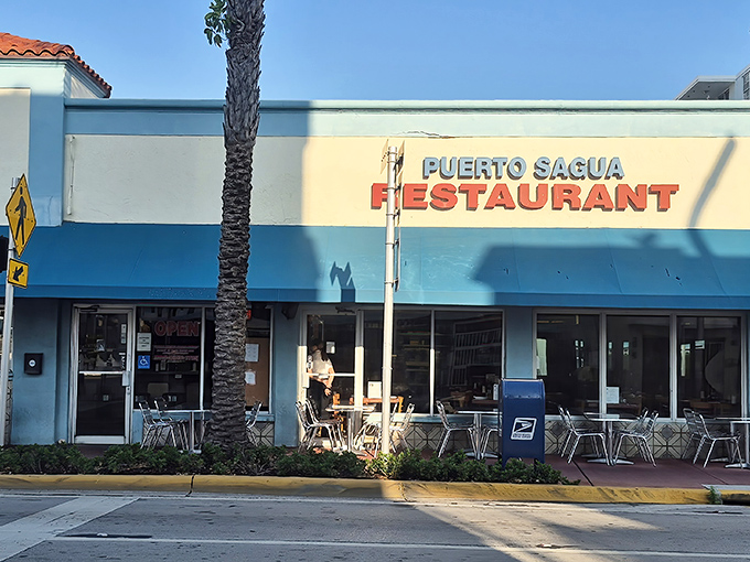 Blue awnings and simple outdoor seating beckon passersby into this unpretentious Collins Avenue institution where Miami's Cuban soul resides.