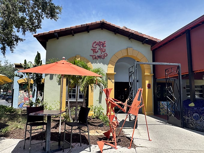The Spanish-style exterior of Café Tu Tu Tango welcomes you with vibrant colors and quirky sculptures—like finding a Barcelona side street in the heart of Orlando.