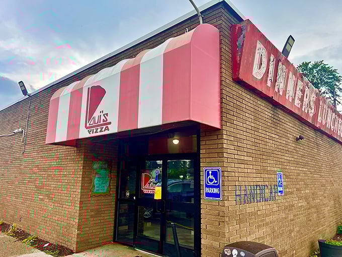 The unassuming brick exterior of Loui's Pizza proves once again that culinary treasures often hide behind modest facades. Michigan's pizza pilgrimage begins here.