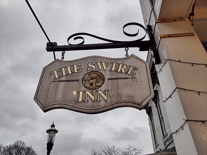 That classic hanging sign—the universal symbol for "good things happen inside"—beckons hungry travelers to step into The Swire Inn's welcoming embrace.