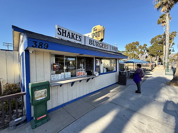 The blue-trimmed beach shack that launched a thousand cravings. The Spot stands proudly on Linden Avenue, a time capsule of California burger perfection.