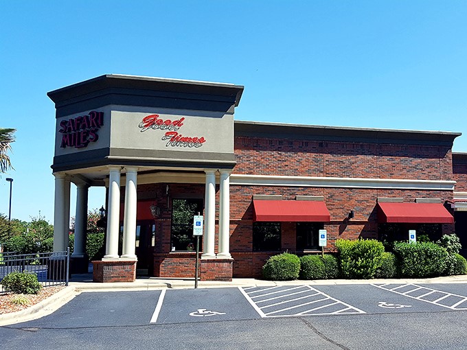 Palm trees in North Carolina? Safari Miles' brick exterior with tropical touches creates an unexpected oasis that promises culinary adventures within.
