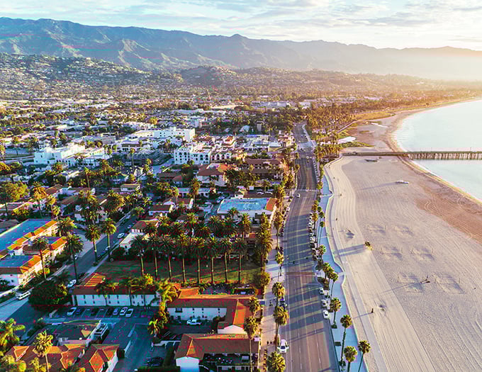 Where mountains embrace the sea in perfect harmony. Santa Barbara's coastline unfolds like a postcard come to life, bathed in golden California sunshine.