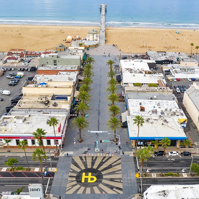 Palm trees line this pedestrian paradise where flip-flops are formal wear and stress evaporates faster than morning fog.