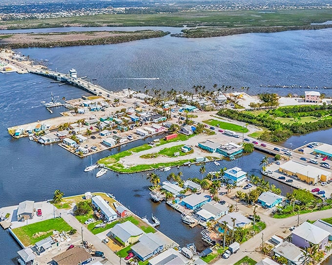 The aerial view reveals Pine Island's unique charm – a patchwork of waterfront homes connected by canals, where boats replace second cars.