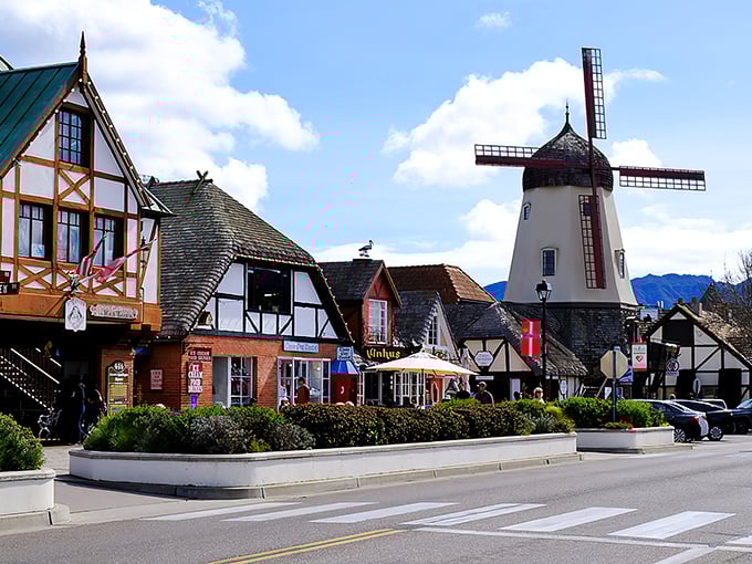 Danish architecture meets California sunshine in Solvang's storybook downtown, where windmills stand guard over half-timbered shops like European sentinels on vacation.